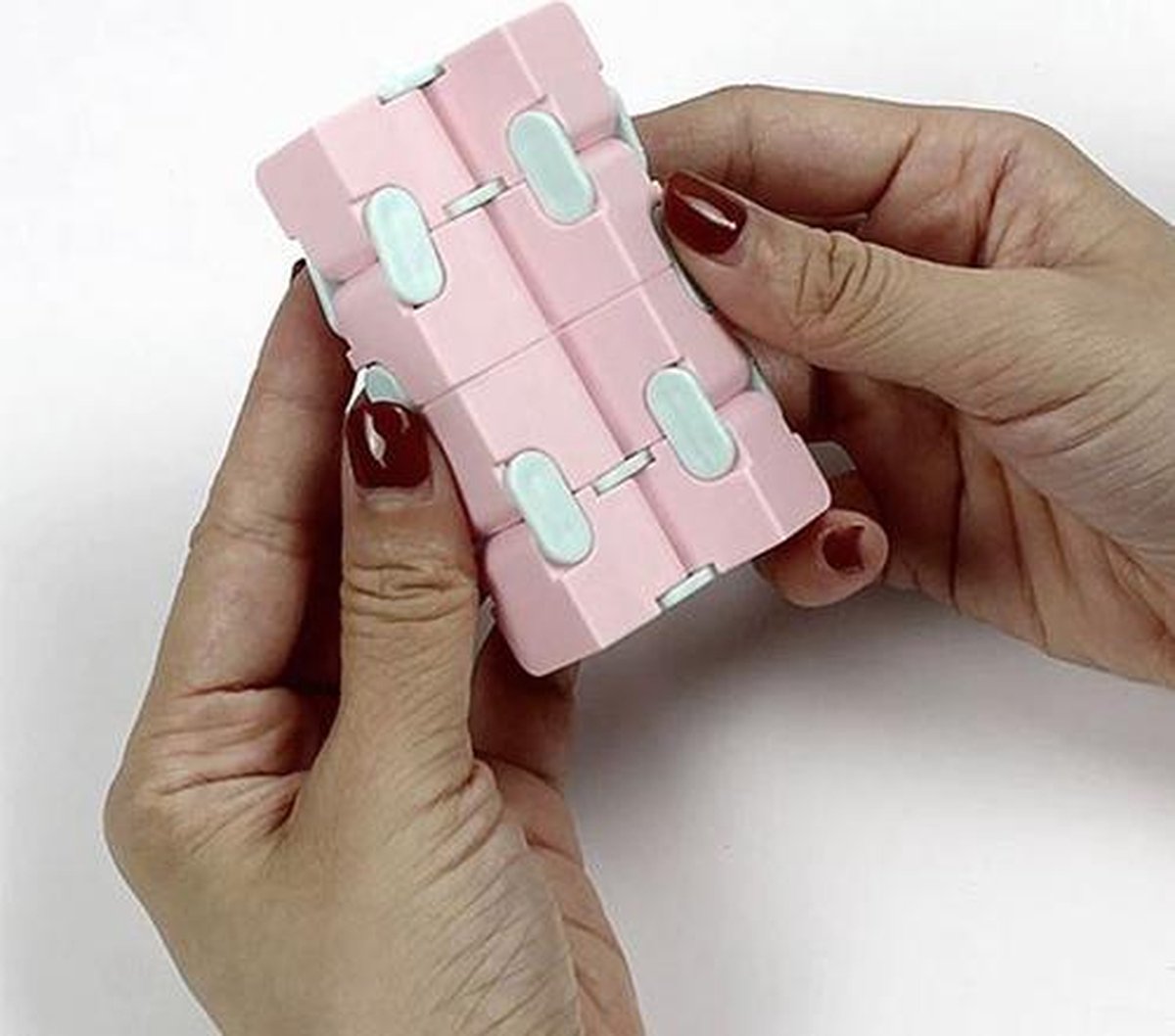 Infinity cube | fidget toys | pastel roze | bol.com