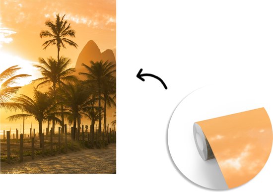 Behang - Fotobehang Palmen bij zonsondergang op het Ipanema-strand in ...