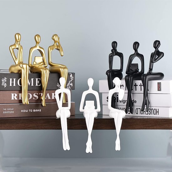 Zittende figuur, abstracte sculptuur van een denkend persoon op een ...