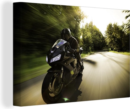 Canvas Schilderij Sportieve motor tussen de zonnestralen - 120x80 cm ...