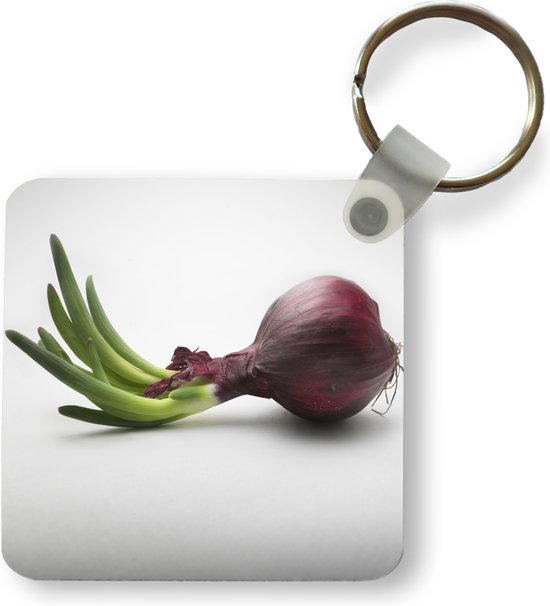 Sleutelhanger - Groene stengel ontspringt uit de bloeiende rode ui ...
