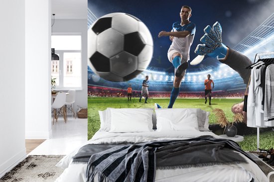 Fotobehang Voetballer Die Een Doel Schiet | bol