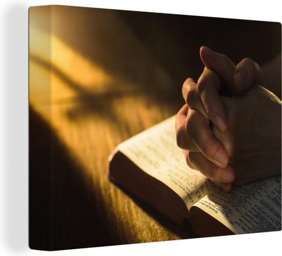 Biddende handen op een opengeslagen bijbel 80x60 cm - Foto print op ...