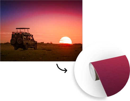 Behang - Fotobehang Jeep rijdt over de steppe van Kenya met ondergaande ...