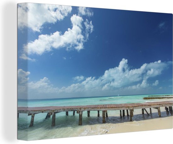 Canvas schilderij 140x90 cm - Wanddecoratie Een promenade bij de Caribische zee op het... | bol