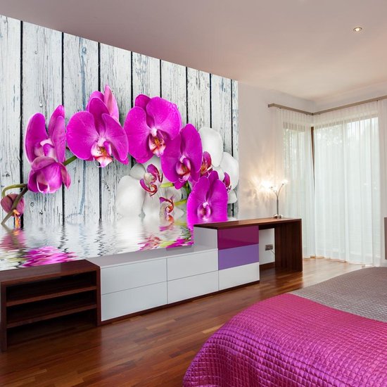 Fotobehang - Violet orchids with water reflexion | bol.com