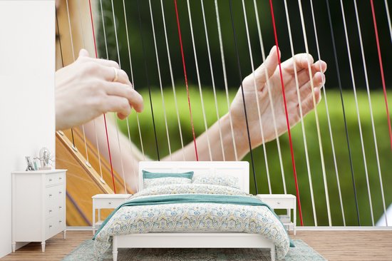 Behang - Fotobehang Persoon speelt harp - Breedte 390 cm x hoogte 260 ...
