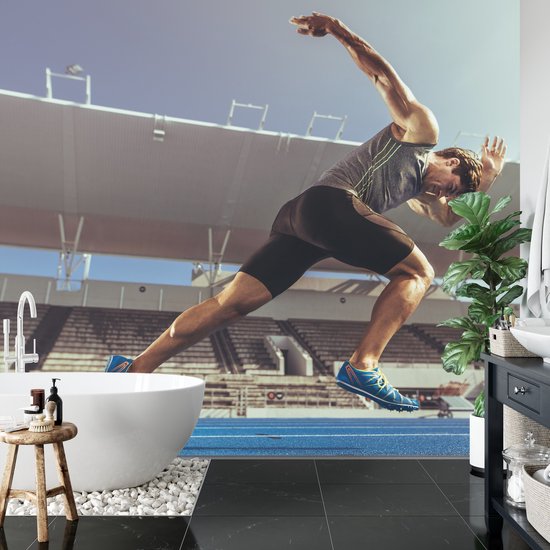 Fotobehang Sprinter Loopt Uit Het Startblok | bol