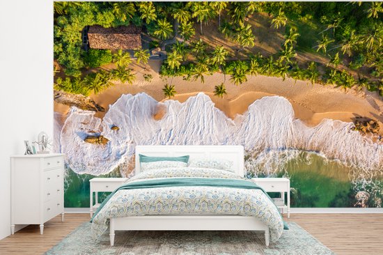 Behang - Fotobehang Een tropisch strand in Ceylon van boven gezien ...