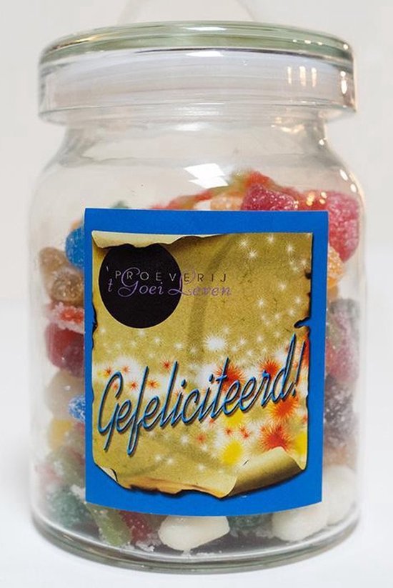 Glazen snoeppot gevuld met een mix van snoepsleutels tumtum en zure ...