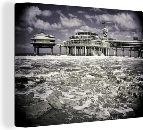 Canvas Schilderij Pier van Scheveningen in de Noordzee - 80x60 cm - Wanddecoratie | bol.com