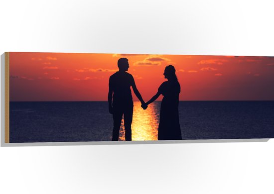Hout - Silhouet van Koppel Hand in Hand bij de Zee tijdens ...