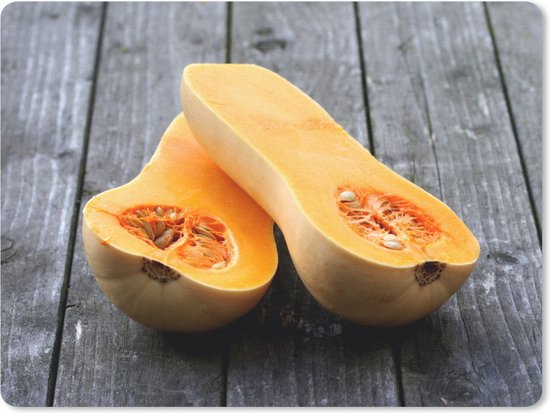 Muismat Muskaatpompoen - Twee helften van een pompoen op oude houten ...