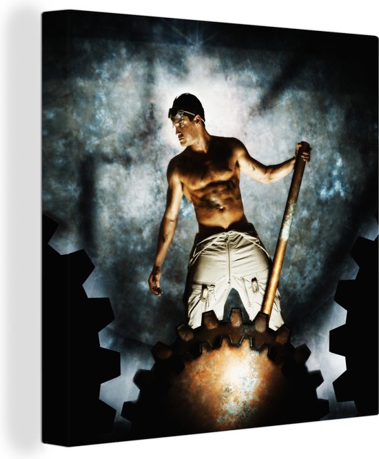 Canvas Schilderij Een man zonder shirt in een fabriek - 90x90 cm ...