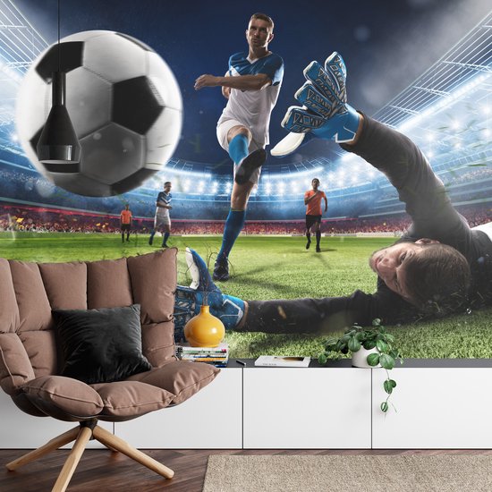 Fotobehang Voetballer Die Een Doel Schiet | bol