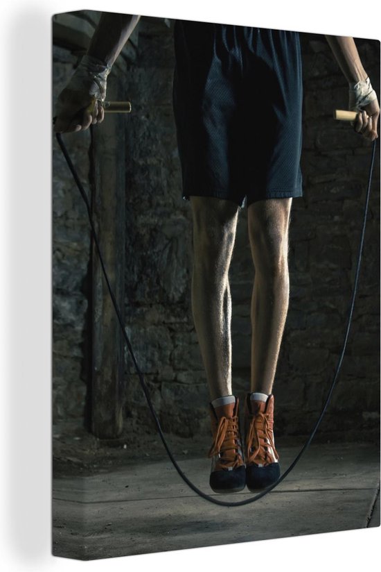 Canvas Schilderij Een blanke bokser springt tijdens fitness over een ...