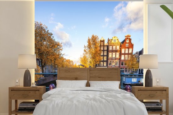 Behang - Fotobehang Fiets voor de gracht met uitzicht op Amsterdamse ...