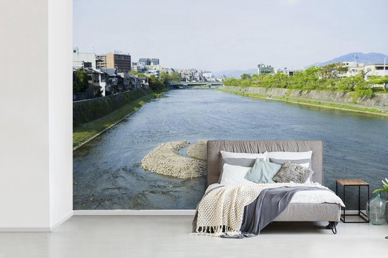 Behang - Fotobehang Yin en Yang teken van grind in een rivier - Breedte ...