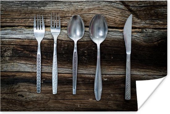 Une collection de couverts en argent, de tailles et de types variables ...