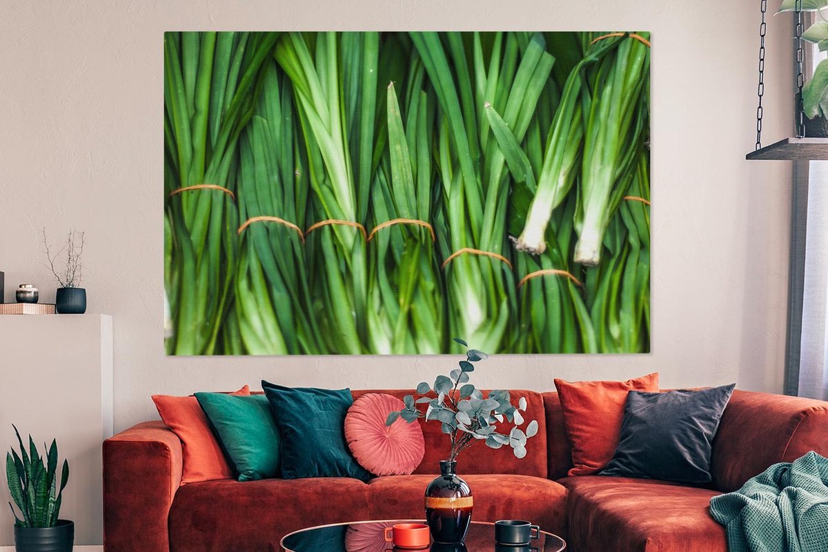 Canvas Schilderij Een afbeelding van gebundelde pijpajuin - 150x100 cm ...