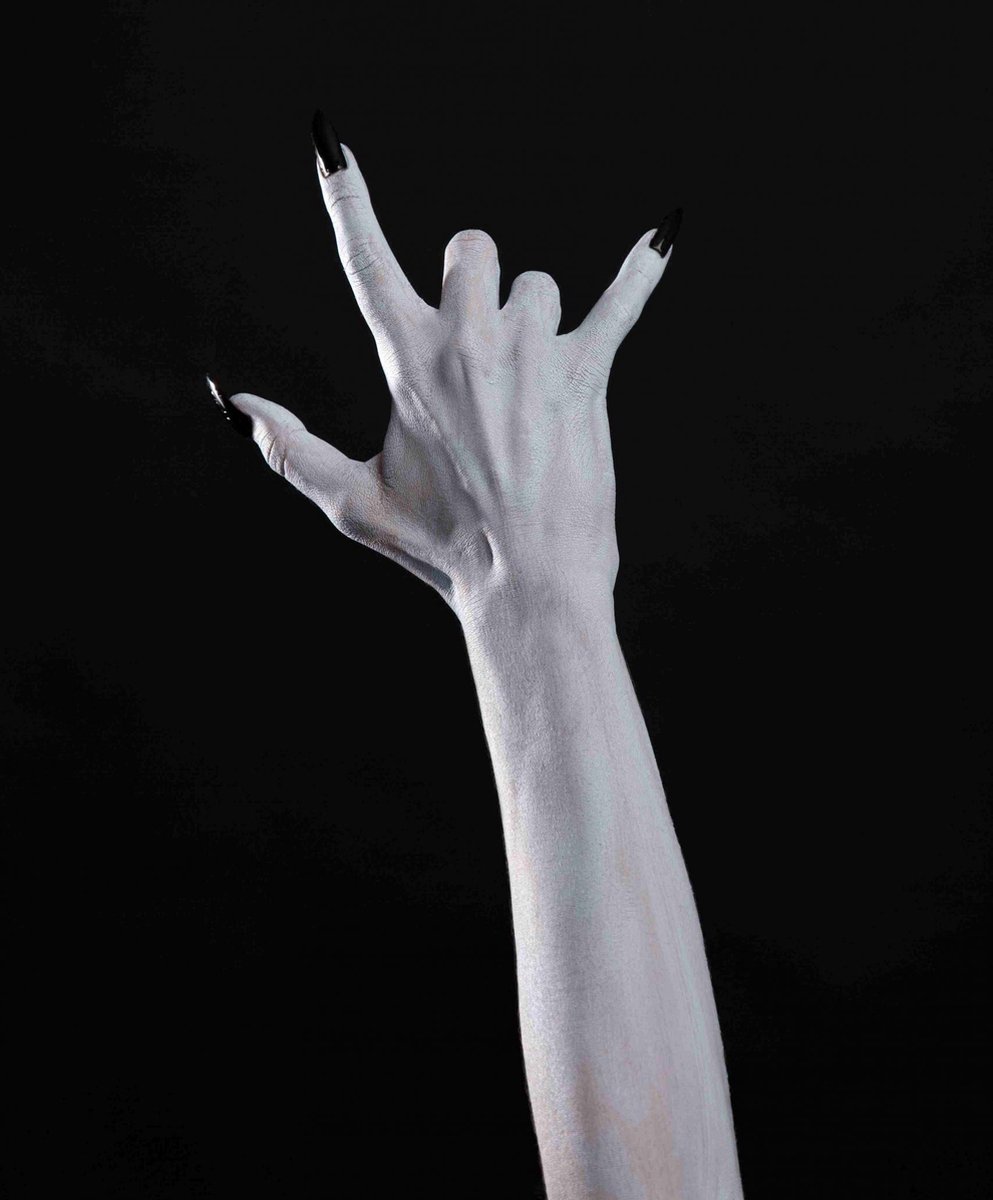 Pale monster hand showing heavy metal symbol, Halloween theme - Moderne ...