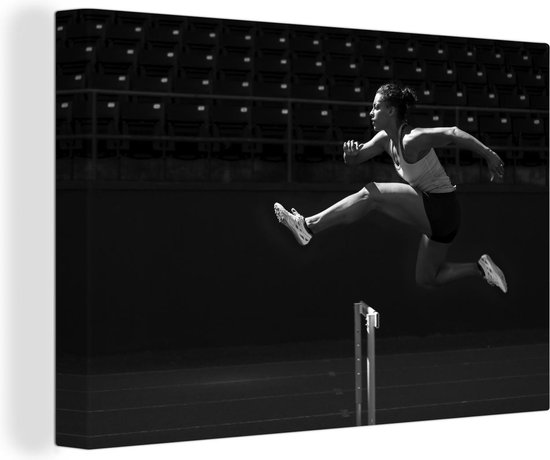 Canvas Schilderij Zwart-wit foto van iemand die aan hordelopen doet ...