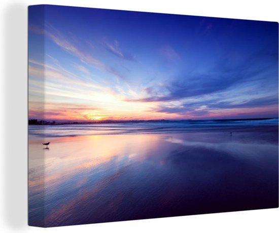 Canvas Schilderij Zonsondergang met kalme kleuren op het strand - 120x80 cm -... | bol