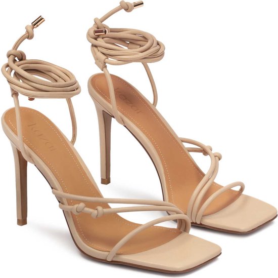 Leather sandals on a heel with a string wrapped around the ankle | bol