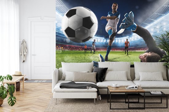 Fotobehang Voetballer Die Een Doel Schiet - Vliesbehang - 315 x 210 cm ...