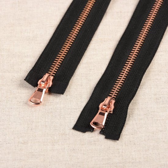 Rits deelbaar 65cm met twee trekkers - dubbele rits zwart met rosé gouden tandjes | bol