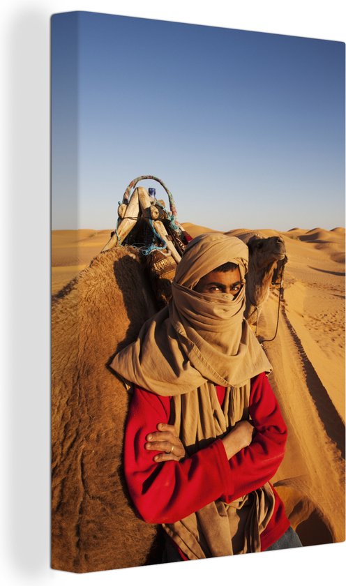 Tableau sur toile Homme assis sur un chameau dans le désert du Sahara ...